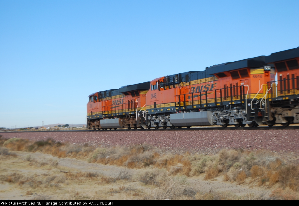 BNSF 6648 passes me by being led by BNSF 7206.